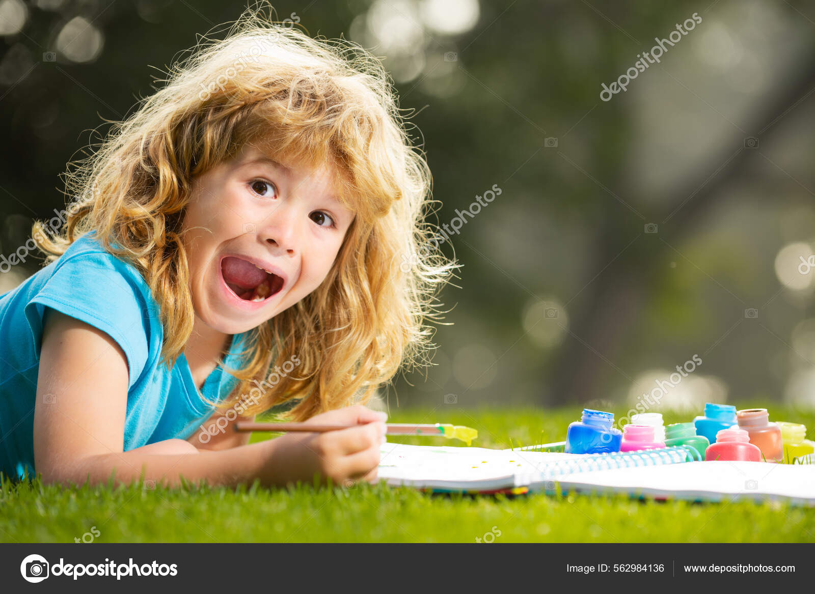 Child boy drawing in summer park, painting art. Little artist painter ...