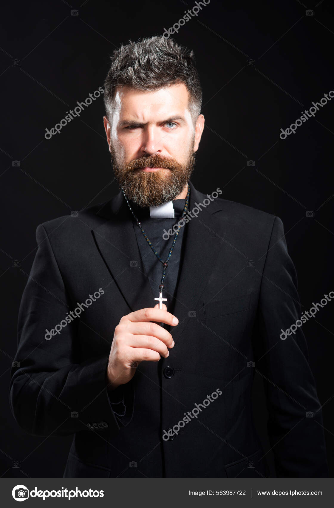 Religion concept. Handsome hispanic catholic priest man over black ...