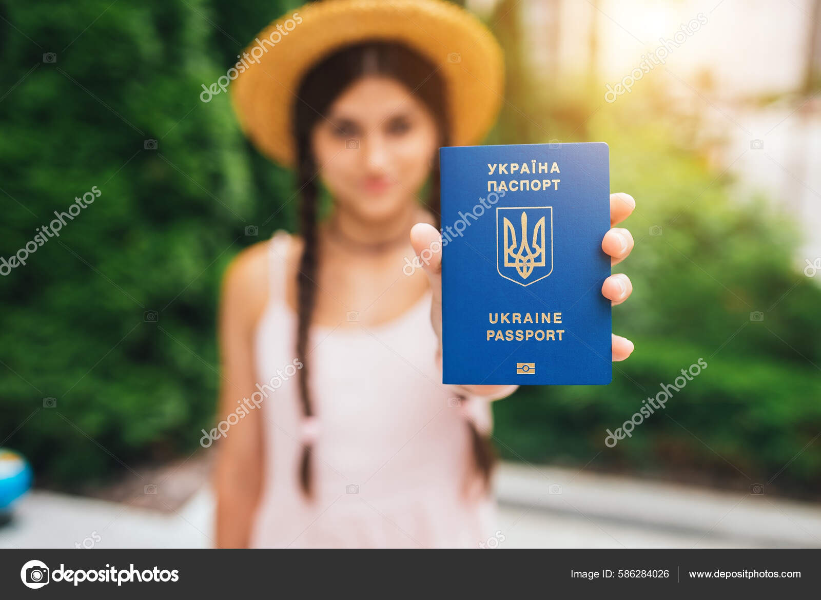 Woman Shows Her Passport Camera Stock Photo by ©simbiothy 586284026