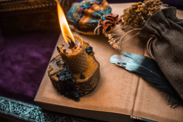 Illustration for esoteric contents, scene with a candle and book of ...