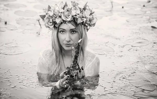 Old European magic, Mystical Pagan scene, woman in lake with a candles ...