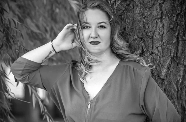 Nice plus size model at city street, European woman in casual dress ...