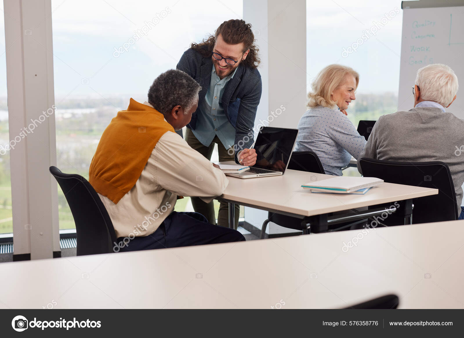 Young Teacher Explaining Senior Student How Solve Informatics Problem ...