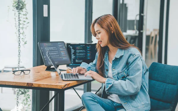 Female programmer working on coding, software development and web design.Concept technology ...