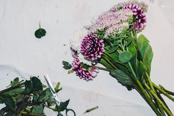 a bouquet of flowers in one color scheme on the table, the concept of ...