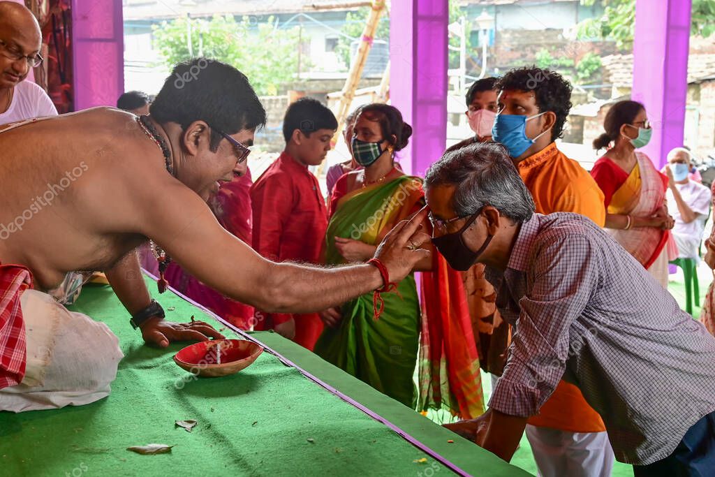 Howrah, West Bengal, India - 14th October 2021 : Hindu Purohit putting ...