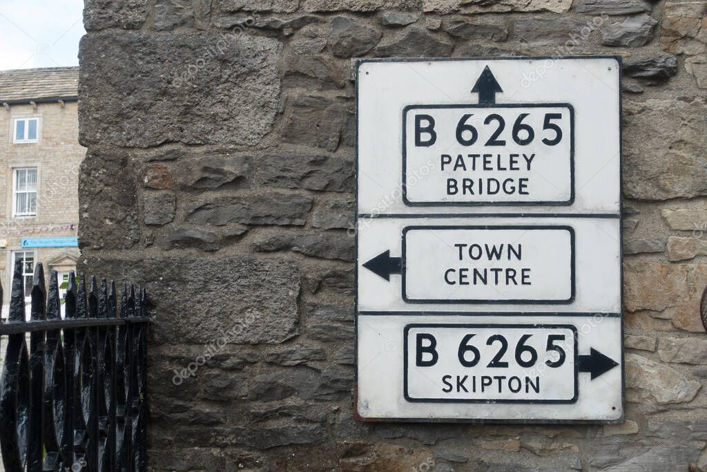 An old road sign indicates the direction on B6265 for Pateley Bridge ...