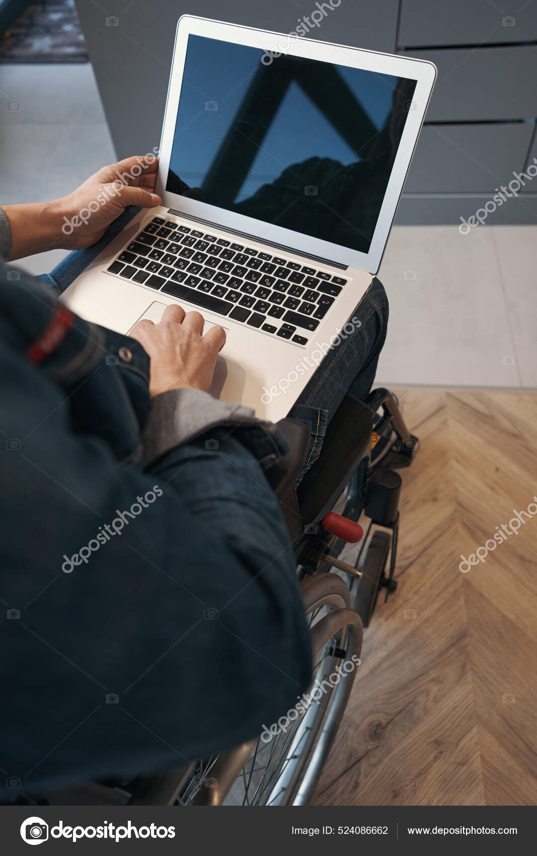 Guy with disability using laptop at home Stock Photo by ...