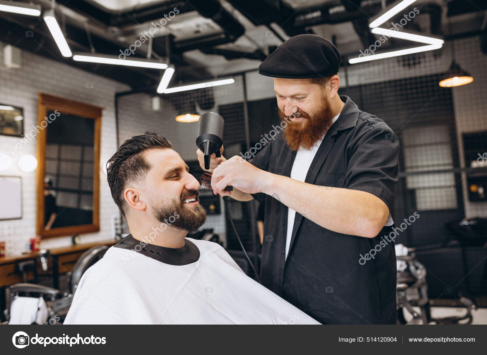Man getting haircut at the barbershop. Professional barber at work ...