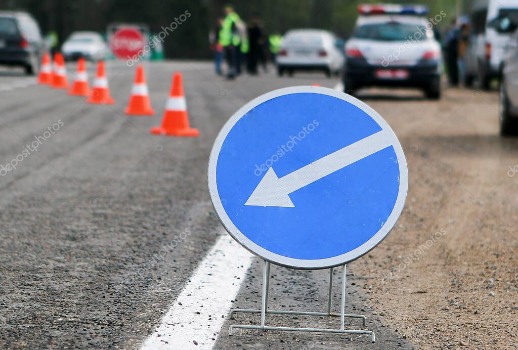 Police checkpoint. A bypass sign on a motor road. Police inspection of ...