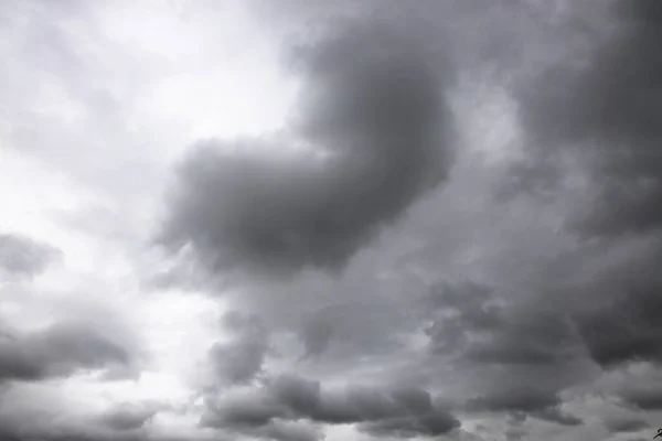 black and white storm clouds background. Light in the Dark and Dramatic Storm Clouds background ...