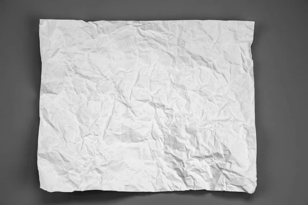 white and gray crumpled paper on gray background. crush paper so that ...