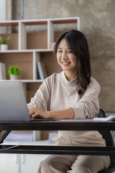 Online study using internet and technology Asian woman using laptop ...