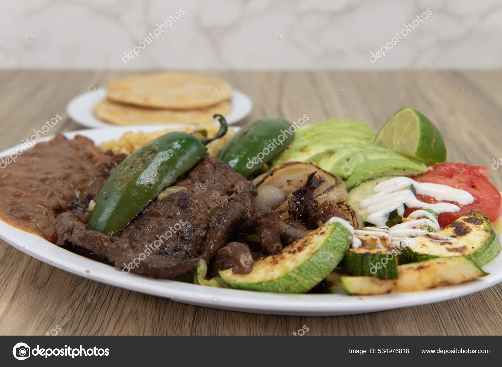 Perfectly Grilled Steak Plate Latino Rice Sliced Avocados Pupusa Side ...