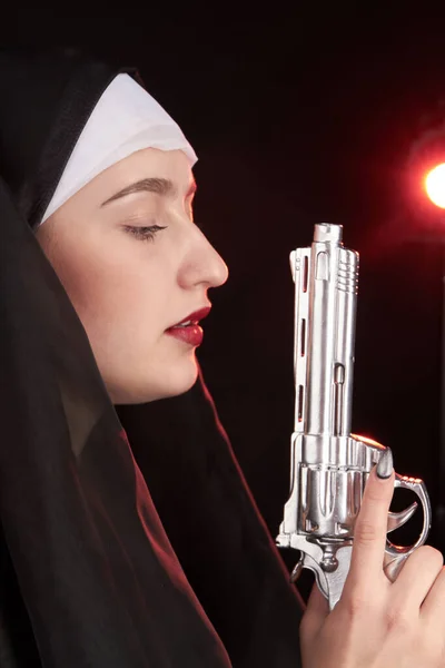 Nun shooting from gun Stock Photos, Royalty Free Nun shooting from gun ...