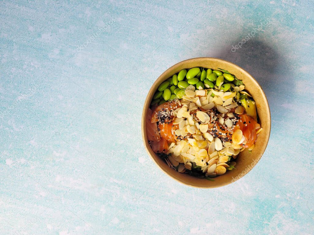 Top view of wok box, bowl of rice on black background. Rice fried and ...