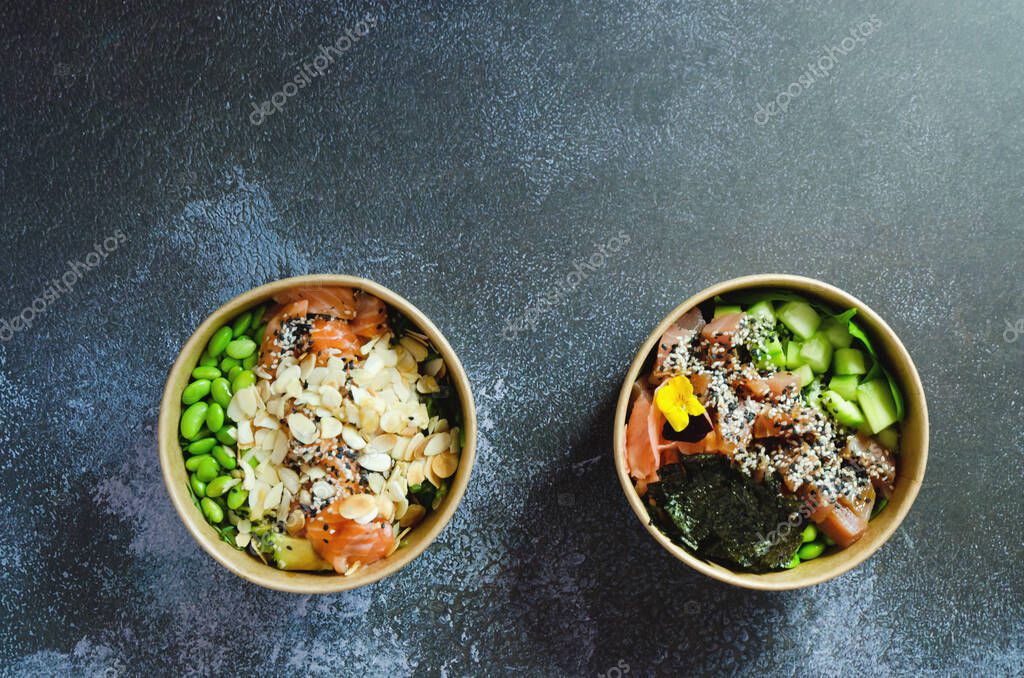 Top view of wok box, bowl of rice on black background. Rice fried and ...