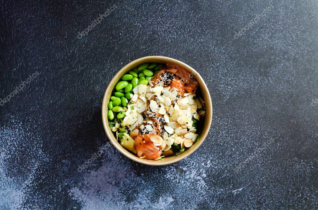 Top view of wok box, bowl of rice on black background. Rice fried and ...