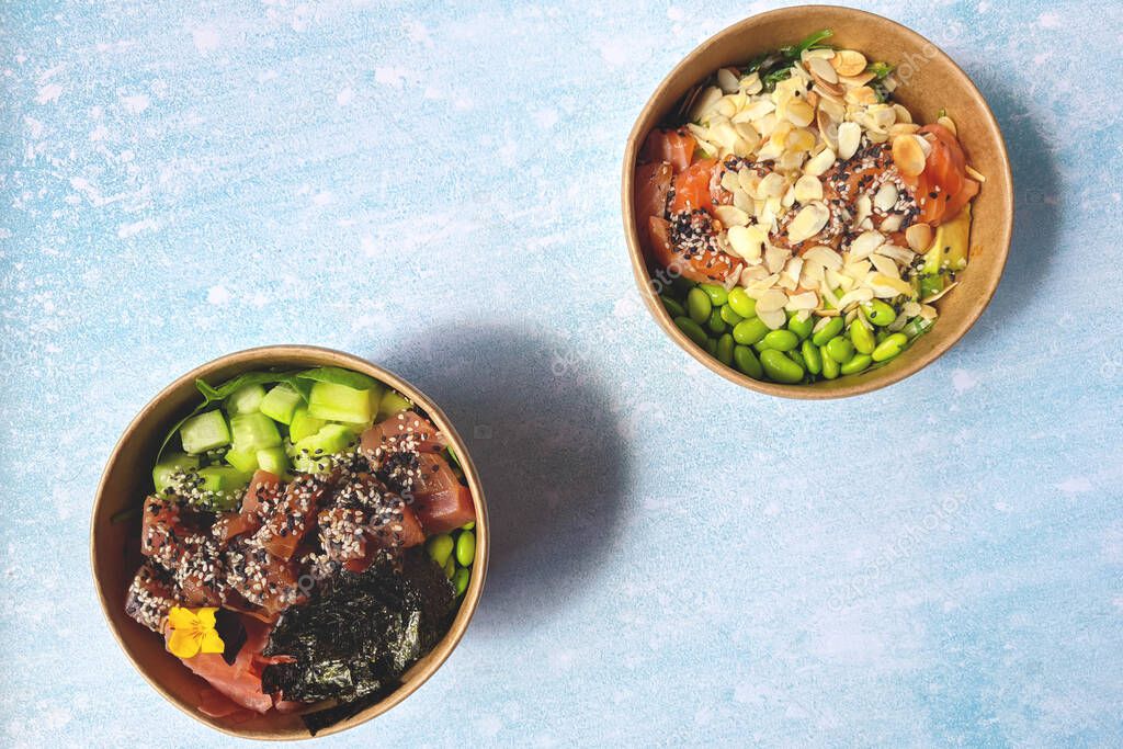 Top view of wok box, bowl of rice on black background. Rice fried and ...