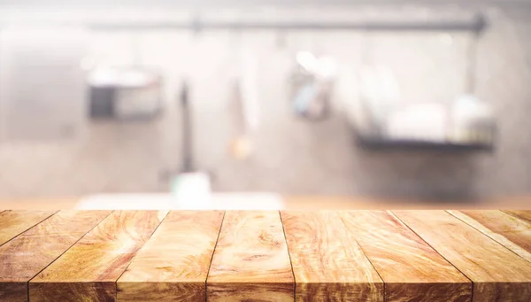 Selective focus.Wood table top on blur kitchen counter background.For ...