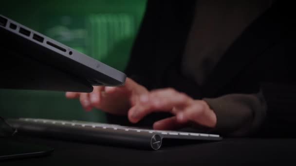 Close up of hands of unrecognizable hacker typing keyboard. Cyber crime ...