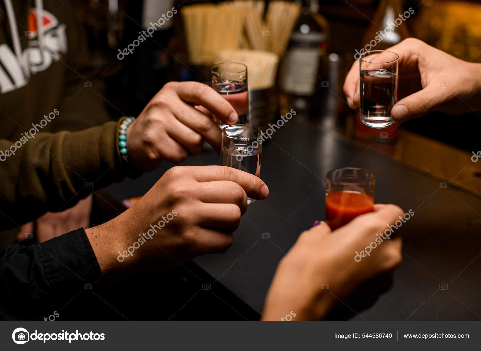 People Taking Shots Of Alcohol