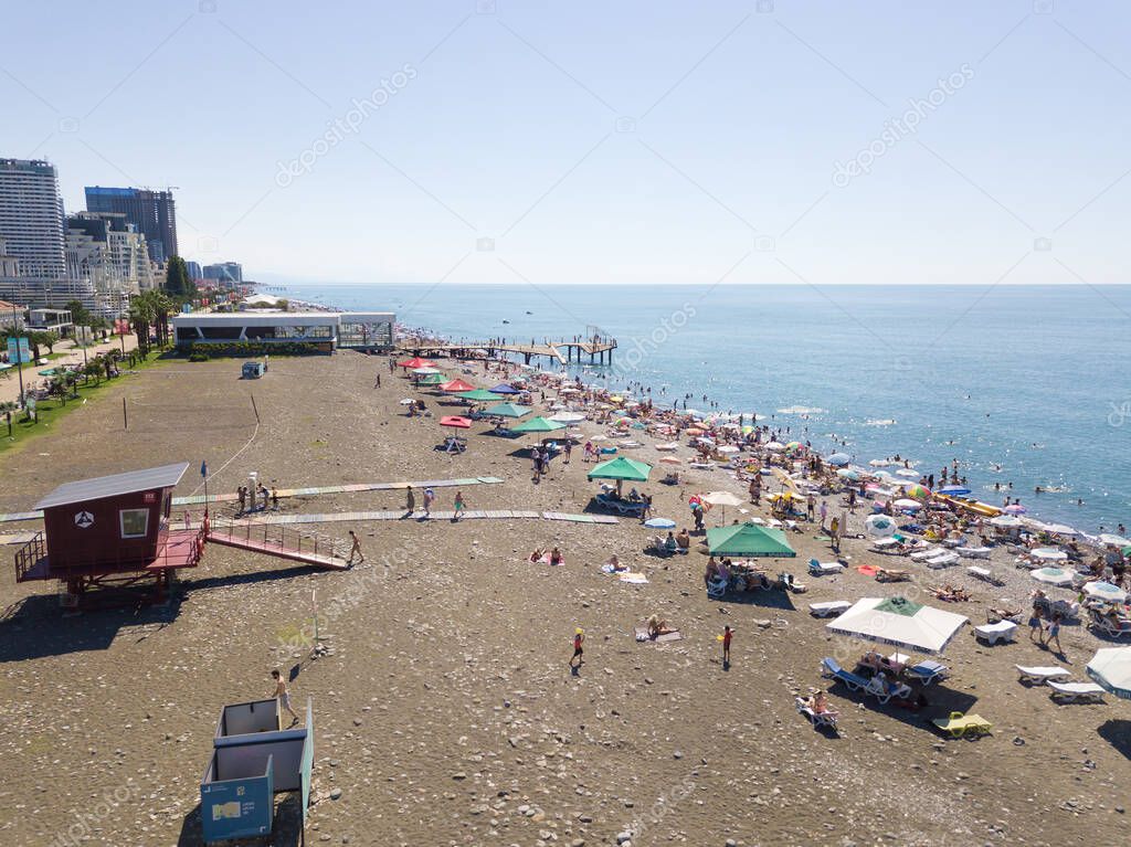 Batumi, Georgia - Jule 27 2022: Drone view of a pebble beach full of ...