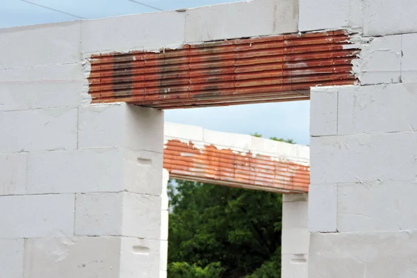 Reinforced brick lintels, rough window openings and walls made of ...