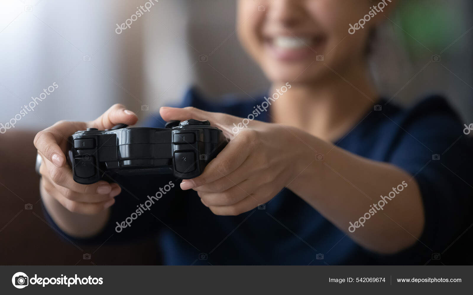 Close up happy young Indian woman using remote controller. — Stock ...