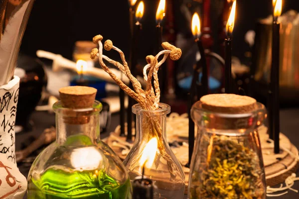 Witchy table arranged with witch craft magic items. Selective focus ...