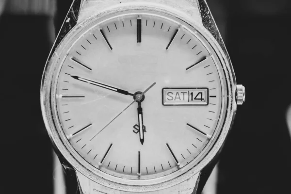Macro photo of a men's watch. Clock hands. An antique clock. Black and ...