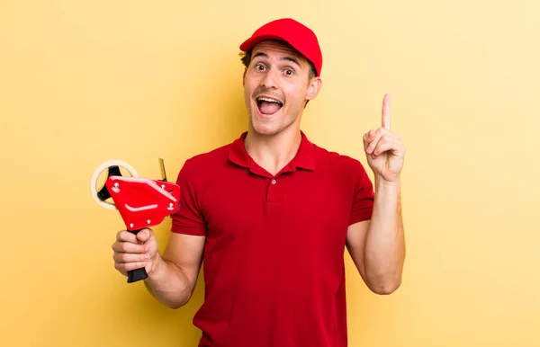 young handsome guy feeling like a happy and excited genius after ...