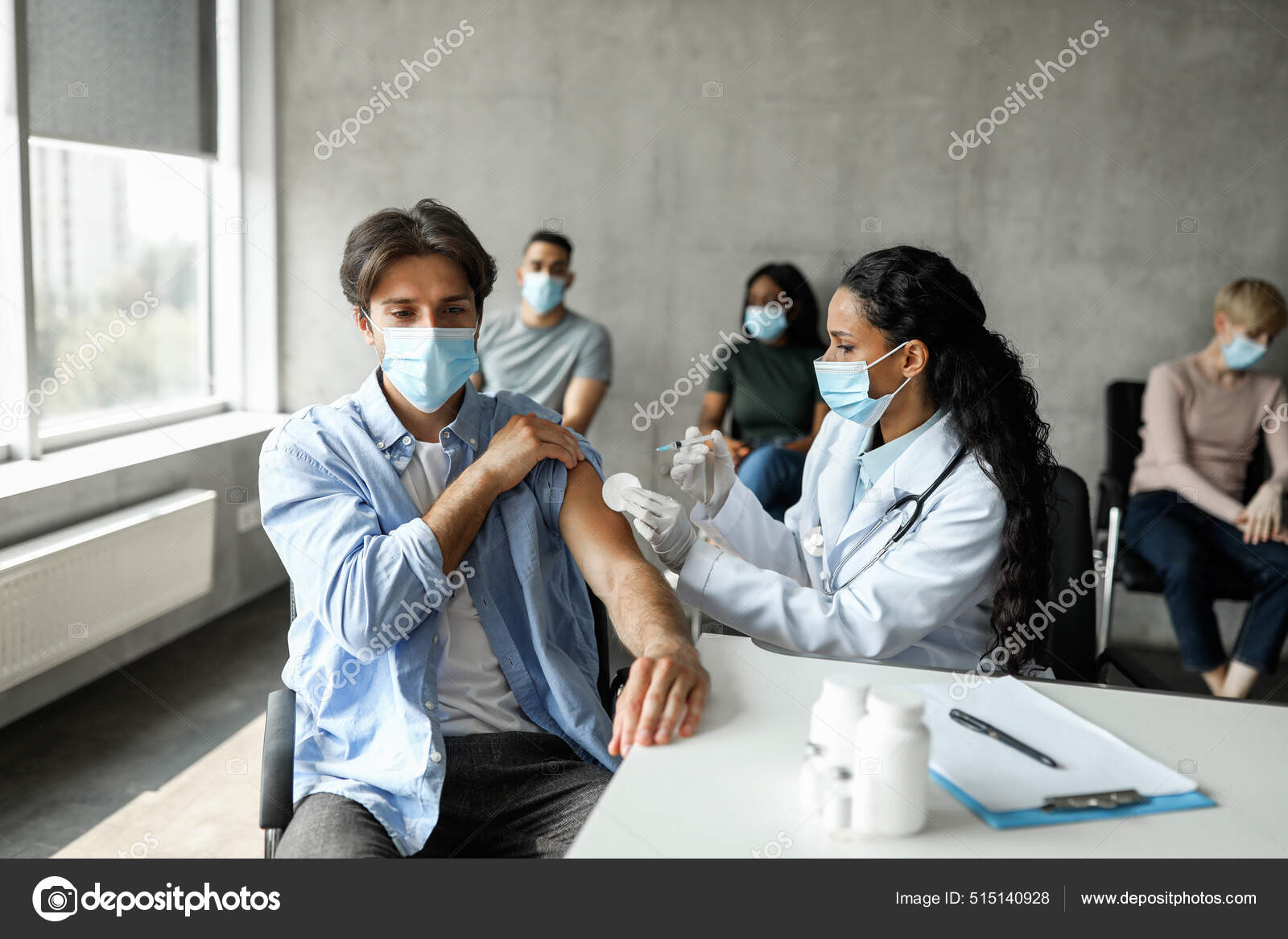 Millennial man getting intramuscular shot in shoulder, vaccination ...