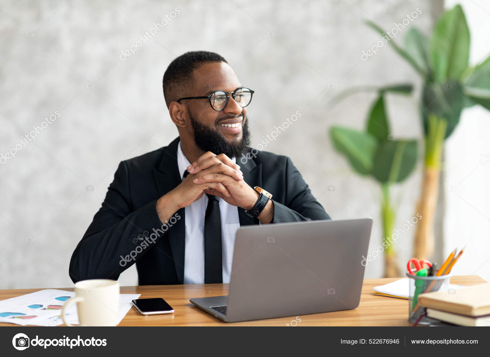 African American man using laptop thinking looking away Stock Photo by ...