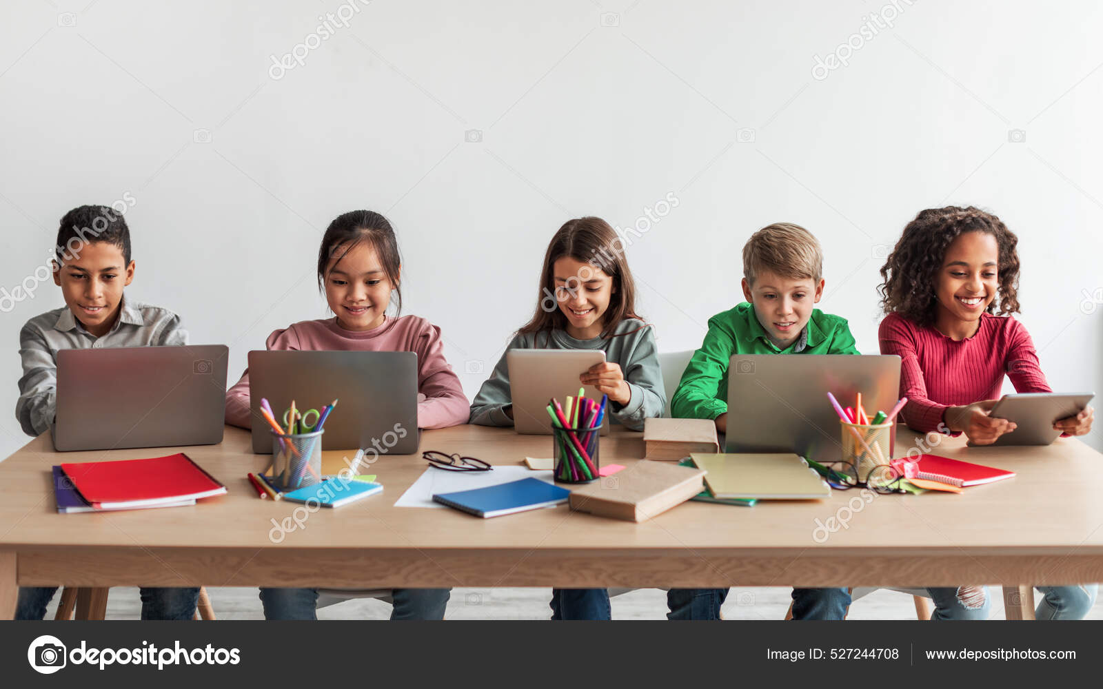 Multicultural School Children Using Laptop Computers Learning In ...