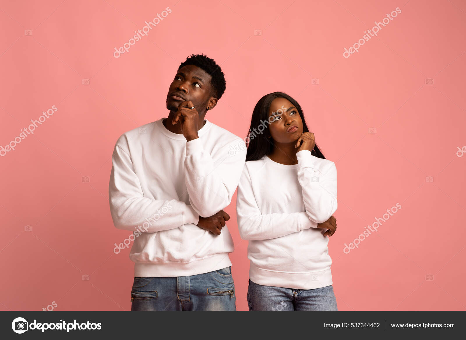 Confused african american man and woman looking aside Stock Photo by ...