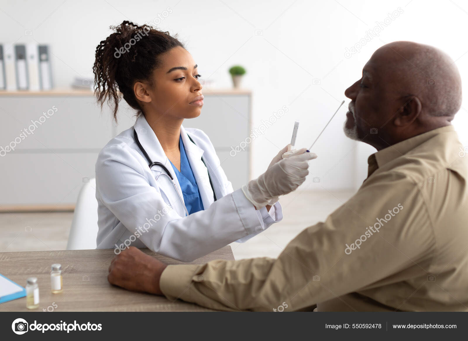 Doctor taking PCR test sample from potentially infected mature man ...