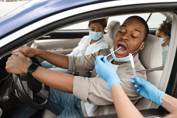 Black Male Driver Getting Tested For Covid-19 Sitting In Automobile ...