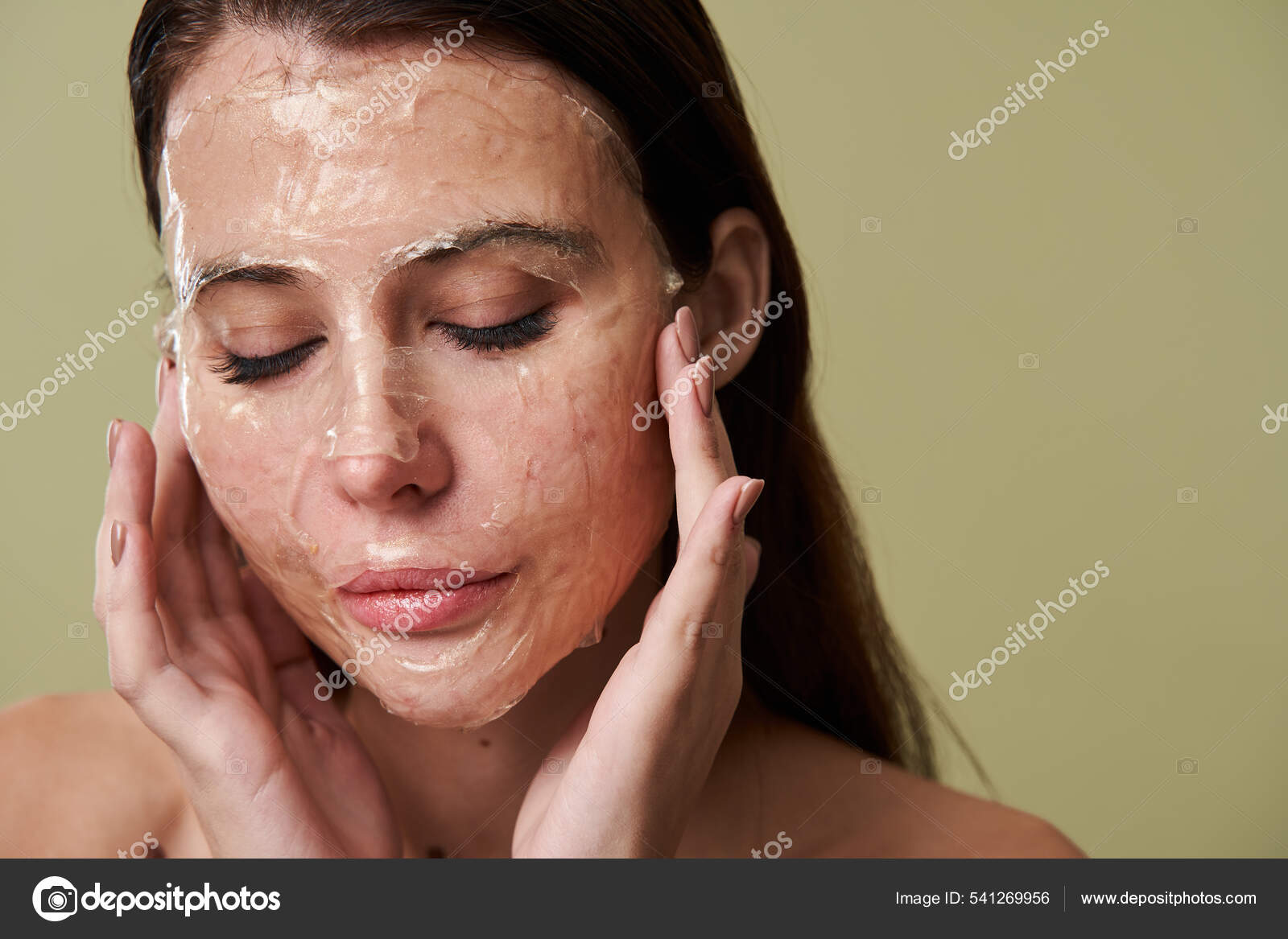 Woman with with post acne spots at her face looking down and touching ...