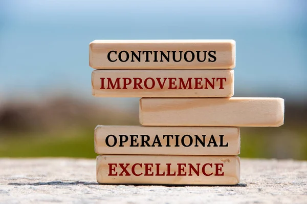 Continuous improvement Operational excellence text on wooden blocks ...