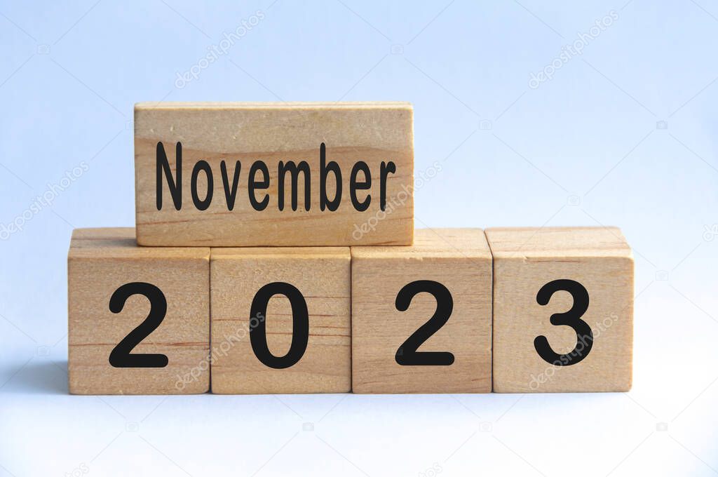 November 2023 text on wooden blocks with white color background. Copy ...