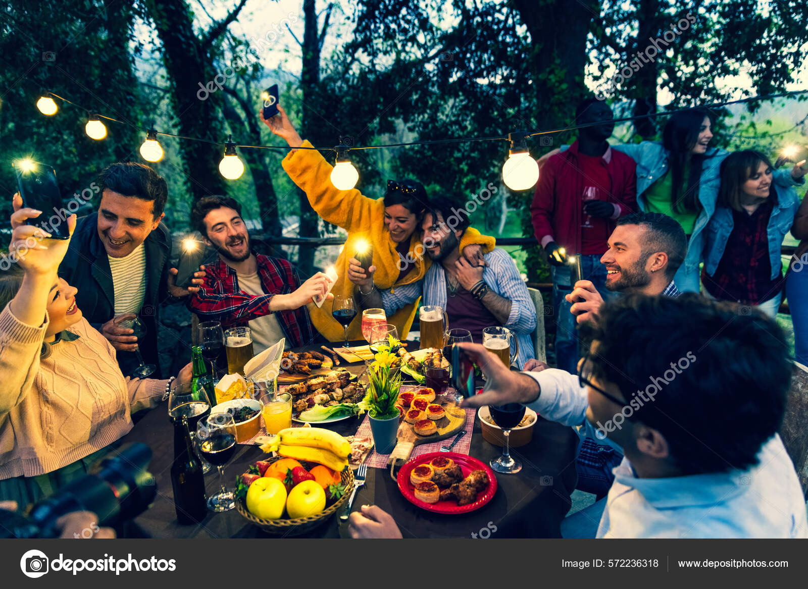 Young People Dining Singing Phone Flashlight Group Friend Having Fun ...