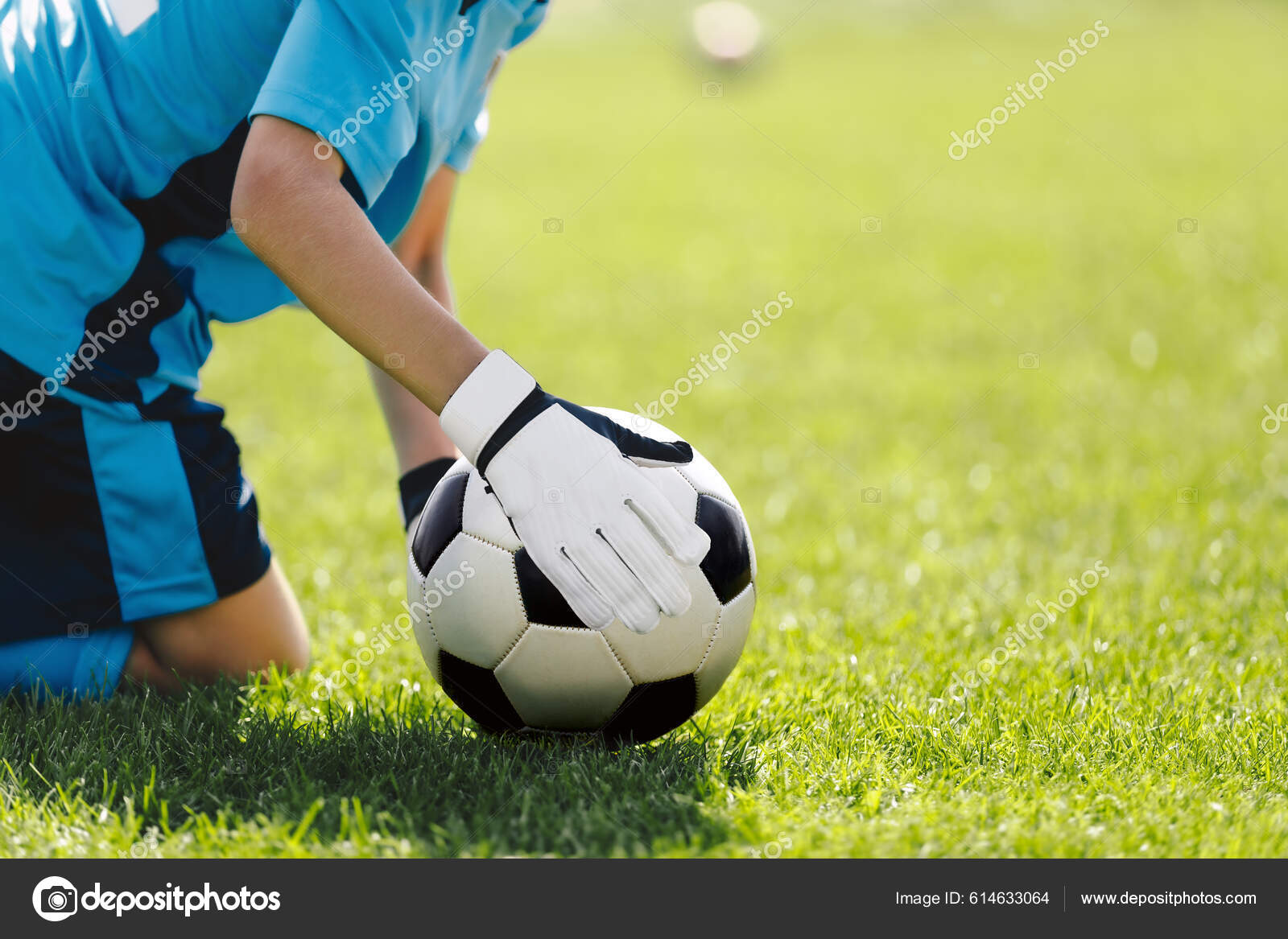 Soccer Goalie Gloves Holding A Ball