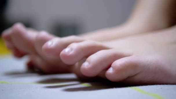 Tired Child Wiggles Toes, Lying on Bed to the Backdrop of Twinkling ...