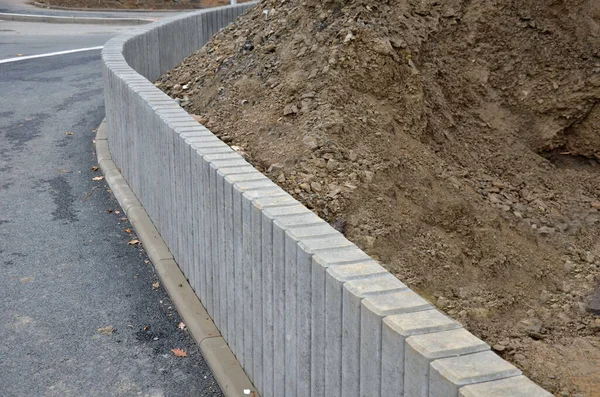 Palisades made of square-profile concrete with sloping staircase arches ...