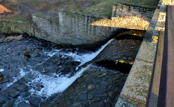 The dam of the breeding fish pond has a canal safety overflow similar ...