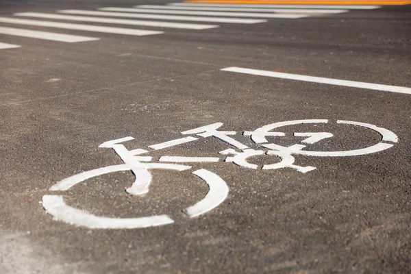 Bicycle lane signage on a street, Bicycle signage on asphalt pavement ...