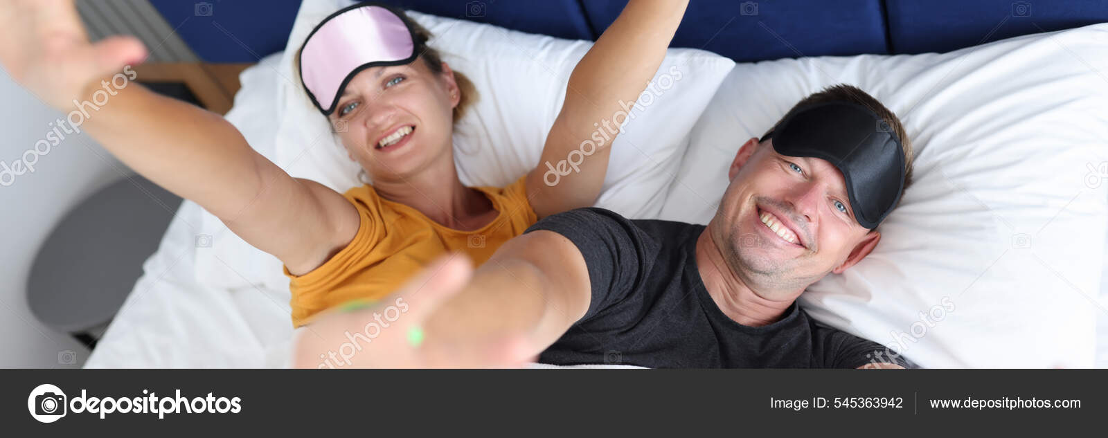Happy young man and woman lie on bed — Stock Photo © megaflopp #545363942
