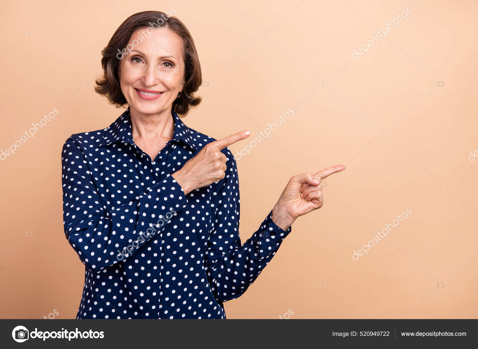 Photo of optimistic old brunette lady index empty space wear blue ...