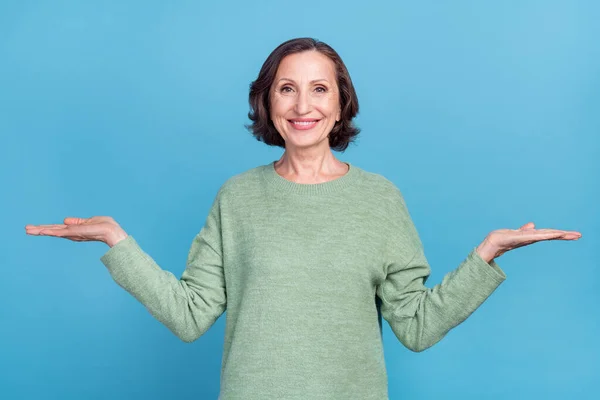 Photo of funky aged grey hairdo lady point look empty space wear teal ...